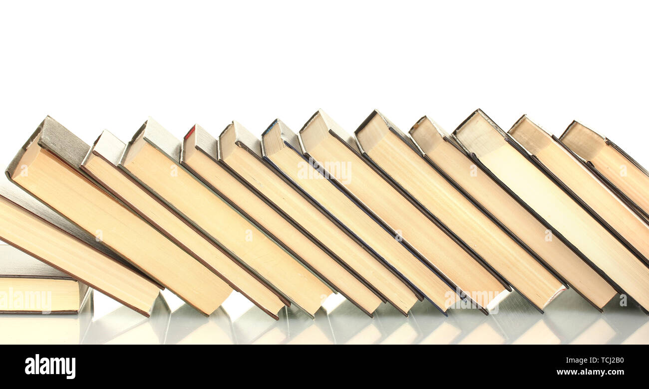 leaning stack of books on white background Stock Photo - Alamy
