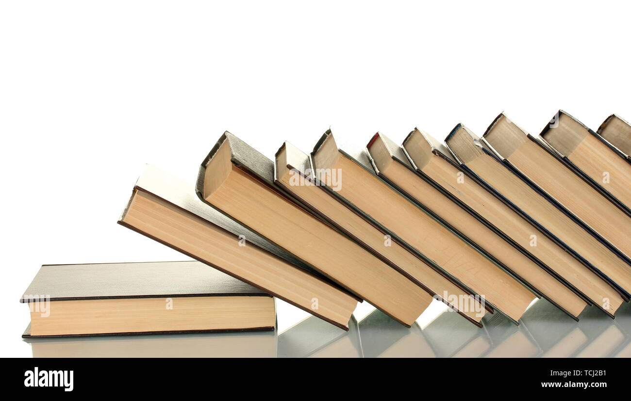 leaning stack of books on white background Stock Photo - Alamy