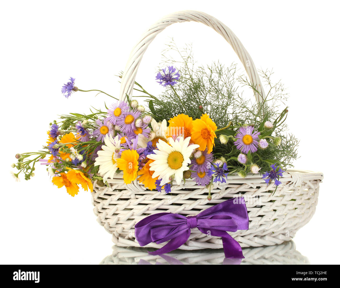 beautiful bouquet of bright wildflowers in basket, isolated on white ...