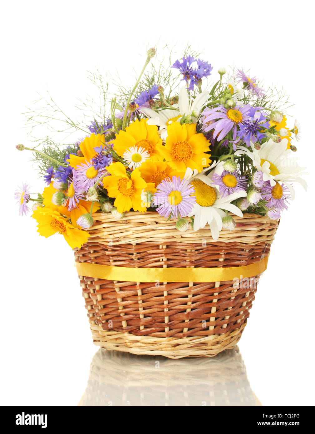 beautiful bouquet of bright wildflowers in basket, isolated on white ...