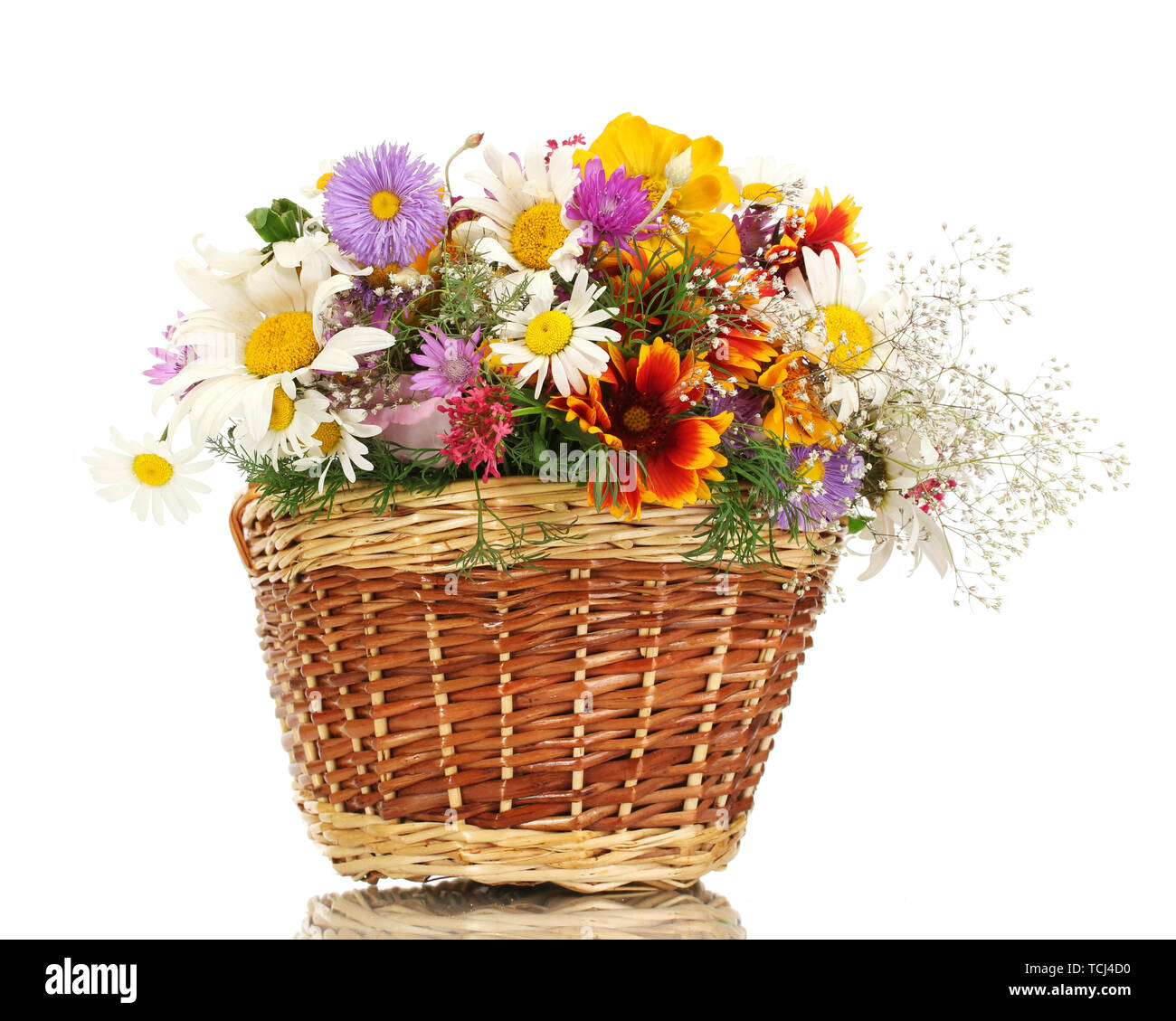 beautiful bouquet of bright wildflowers in basket, isolated on white ...