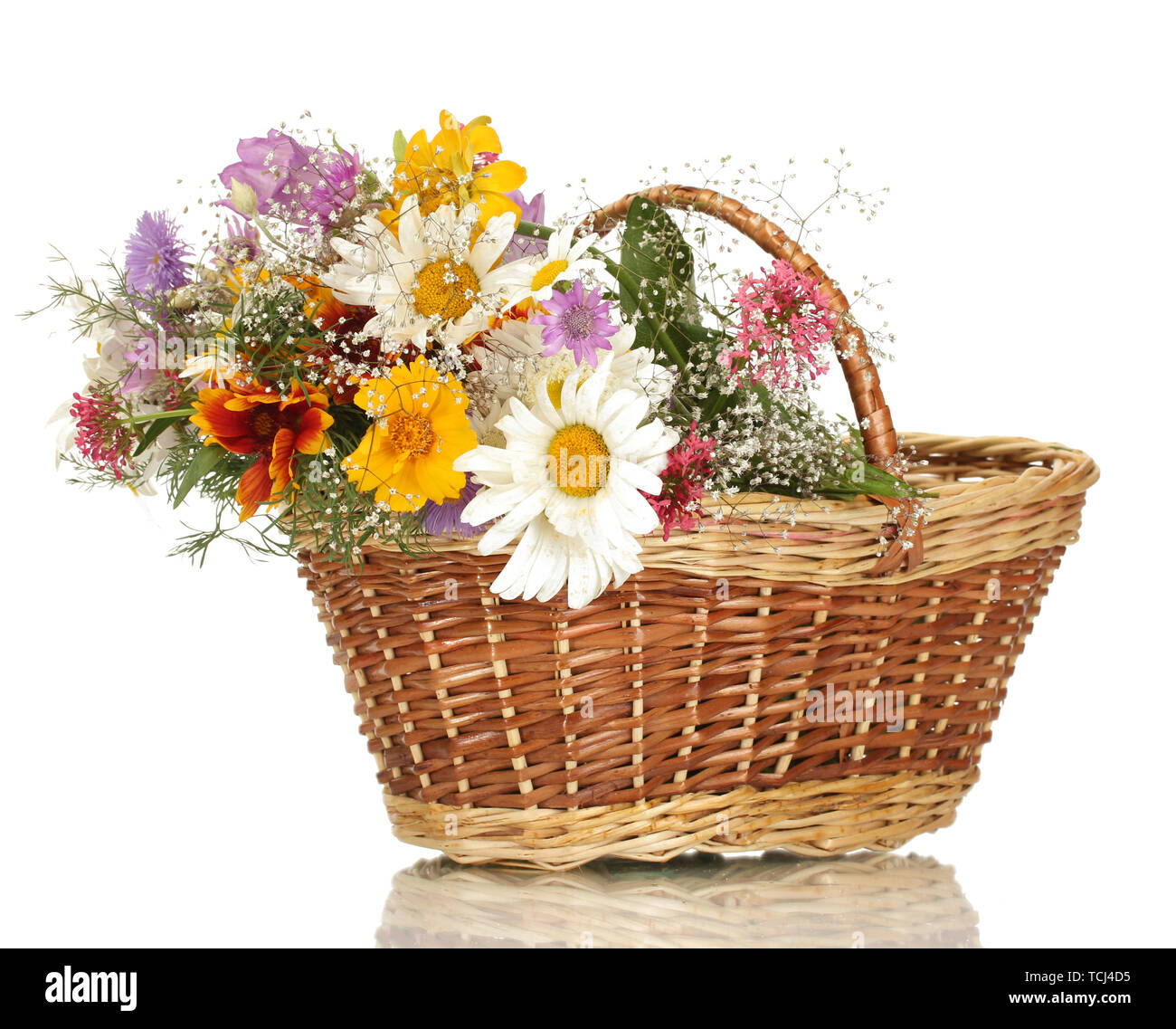 beautiful bouquet of bright wildflowers in basket, isolated on white ...