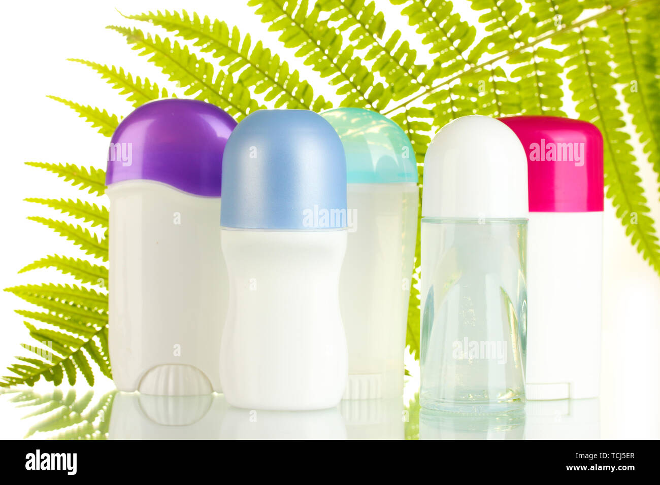 deodorants with green leaf isolated on white Stock Photo - Alamy