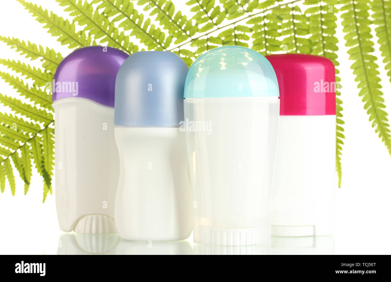 deodorants with green leaf isolated on white Stock Photo - Alamy