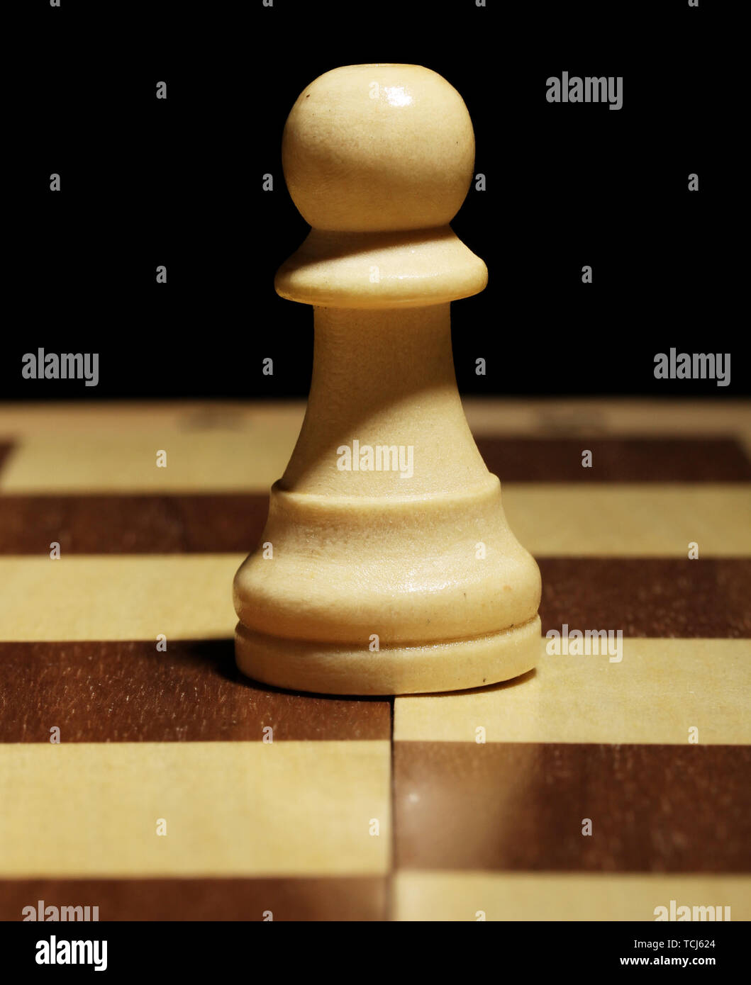 Chess board with chess piece isolated on black Stock Photo - Alamy