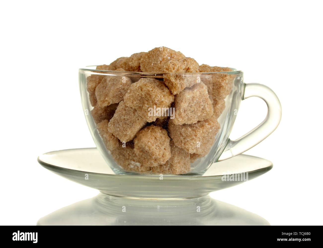 Lump brown cane sugar cubes in glass cup isolated on white Stock Photo ...