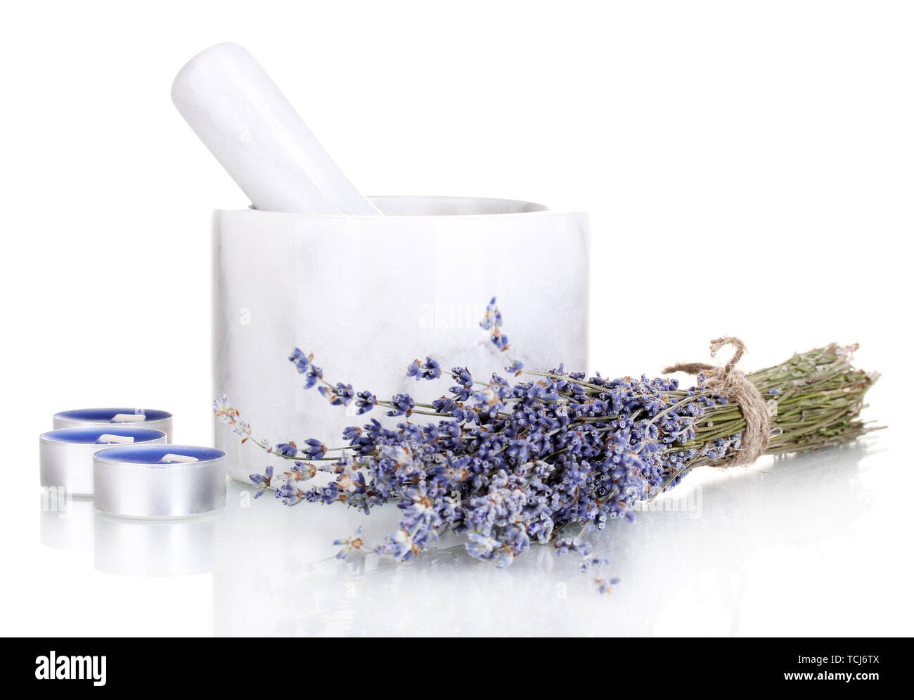 Lavender flowers with mortar and candles isolated on white Stock Photo - Alamy