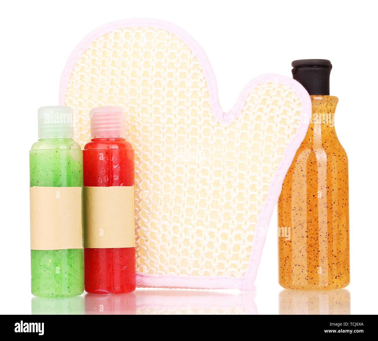 Bottles with scrub and sponge isolated on white Stock Photo - Alamy