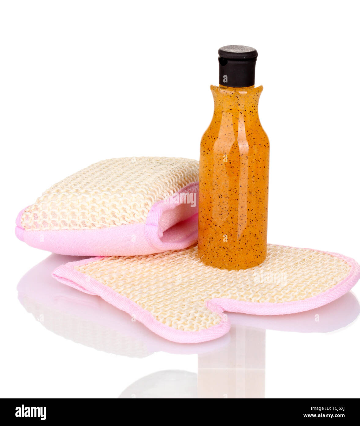 Bottle with scrub and sponges isolated on white Stock Photo - Alamy