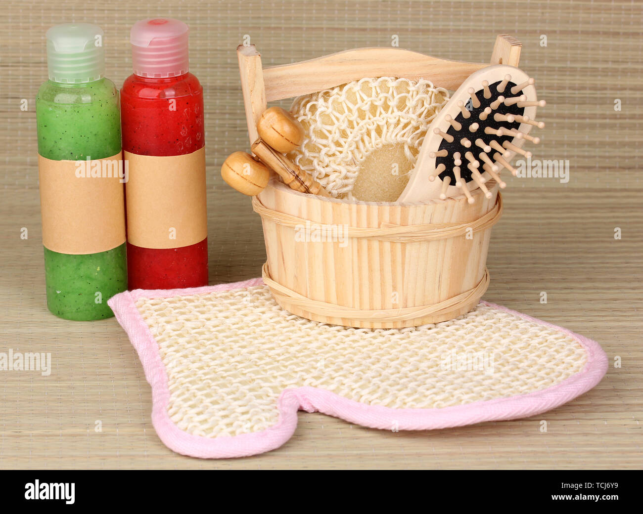 Bathroom set with scrub on bamboo background Stock Photo - Alamy