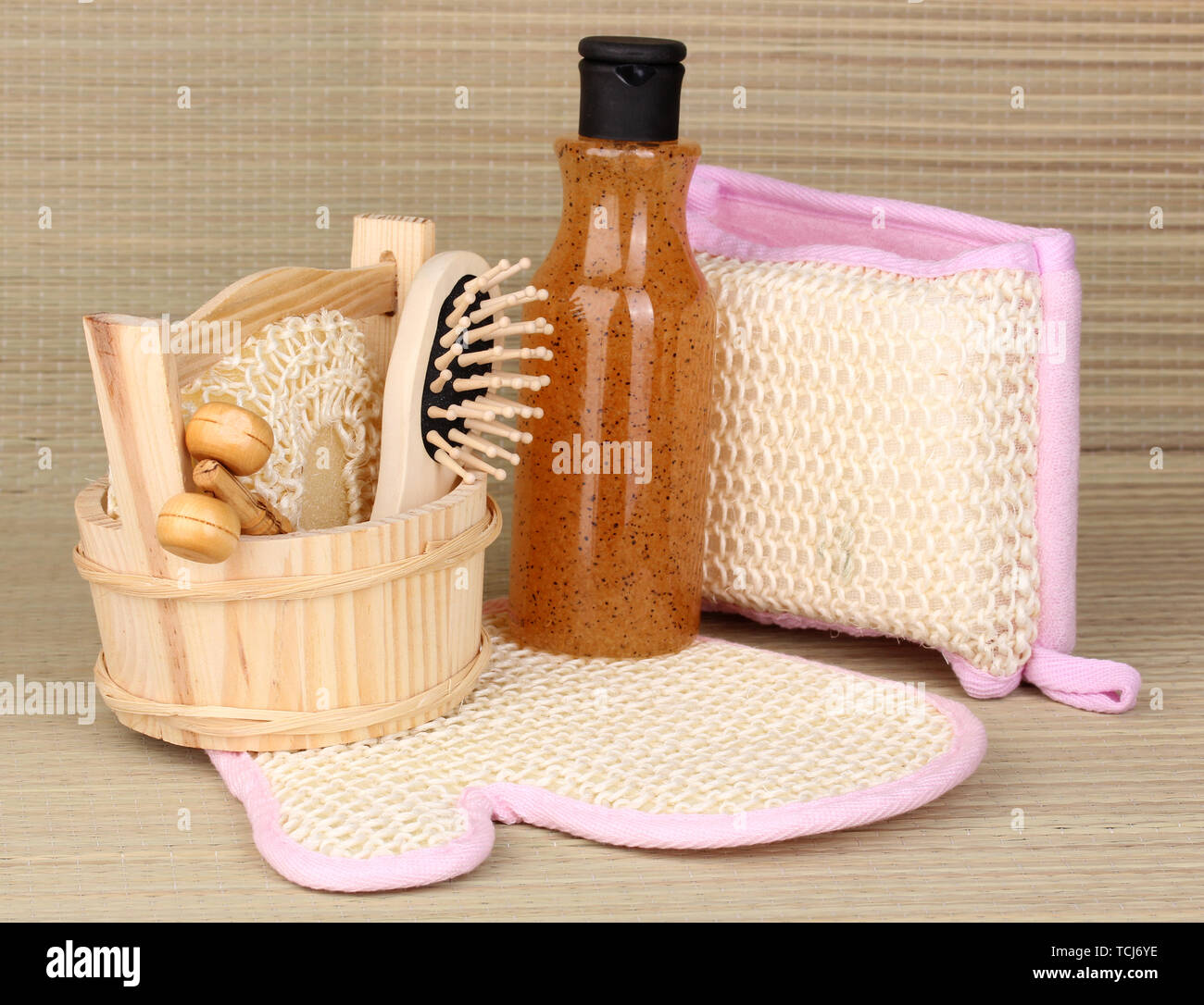 Bathroom set with scrub on bamboo background Stock Photo - Alamy
