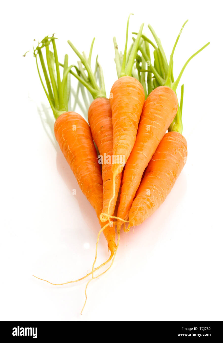 Carrots isolated on white Stock Photo - Alamy