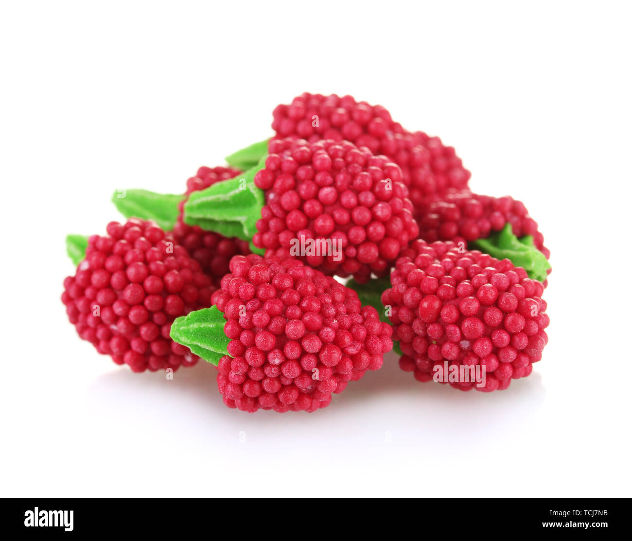 red candy raspberries isolated on white Stock Photo - Alamy