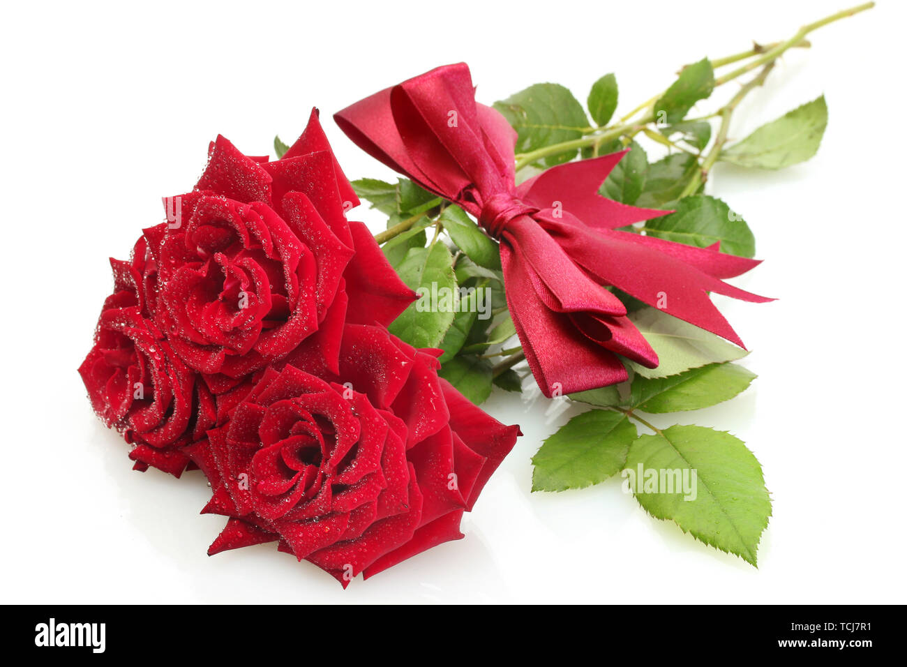 three beautiful red roses with drops isolated on white Stock Photo - Alamy