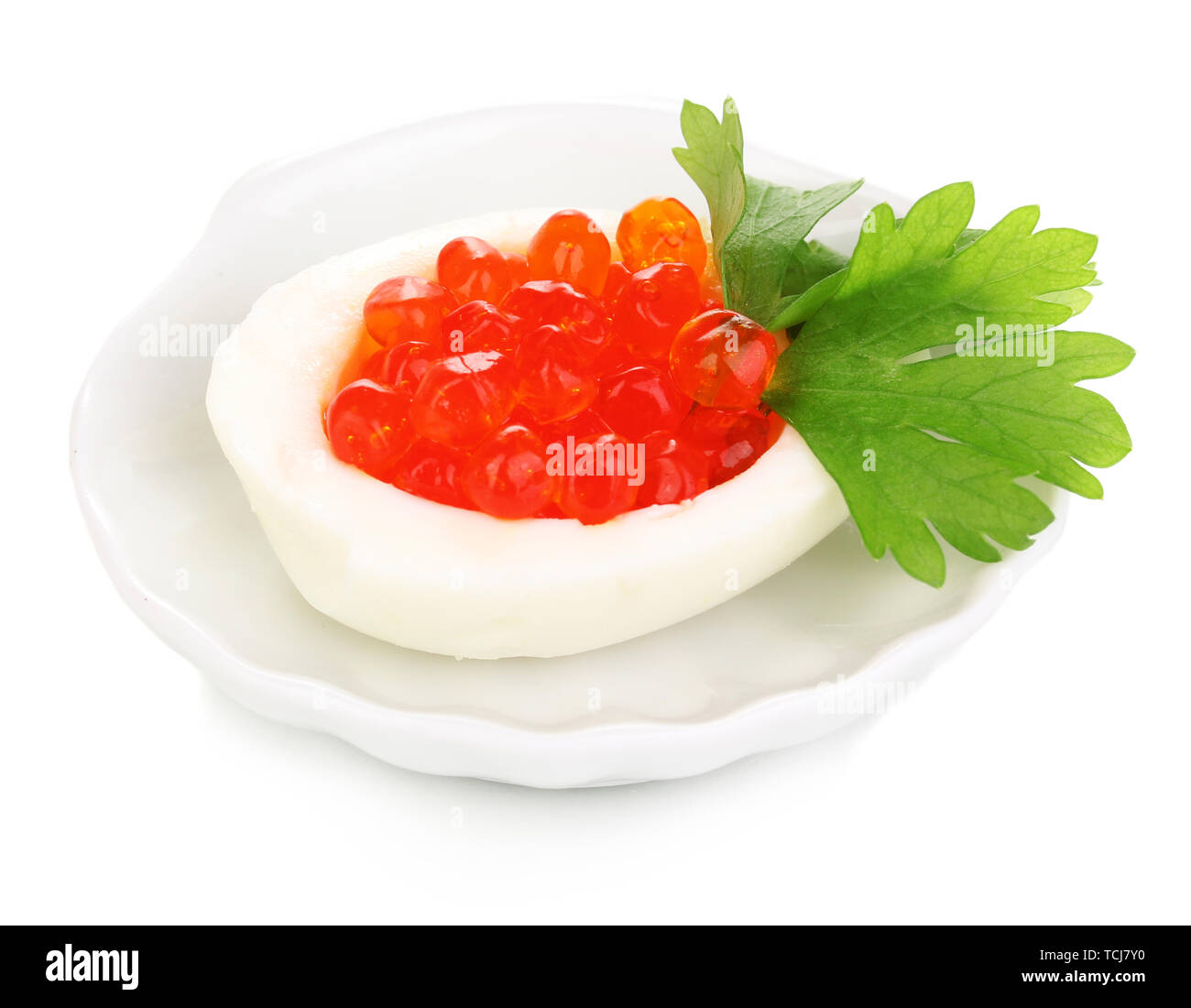 Red caviar in egg on little white saucer isolated on white Stock Photo ...