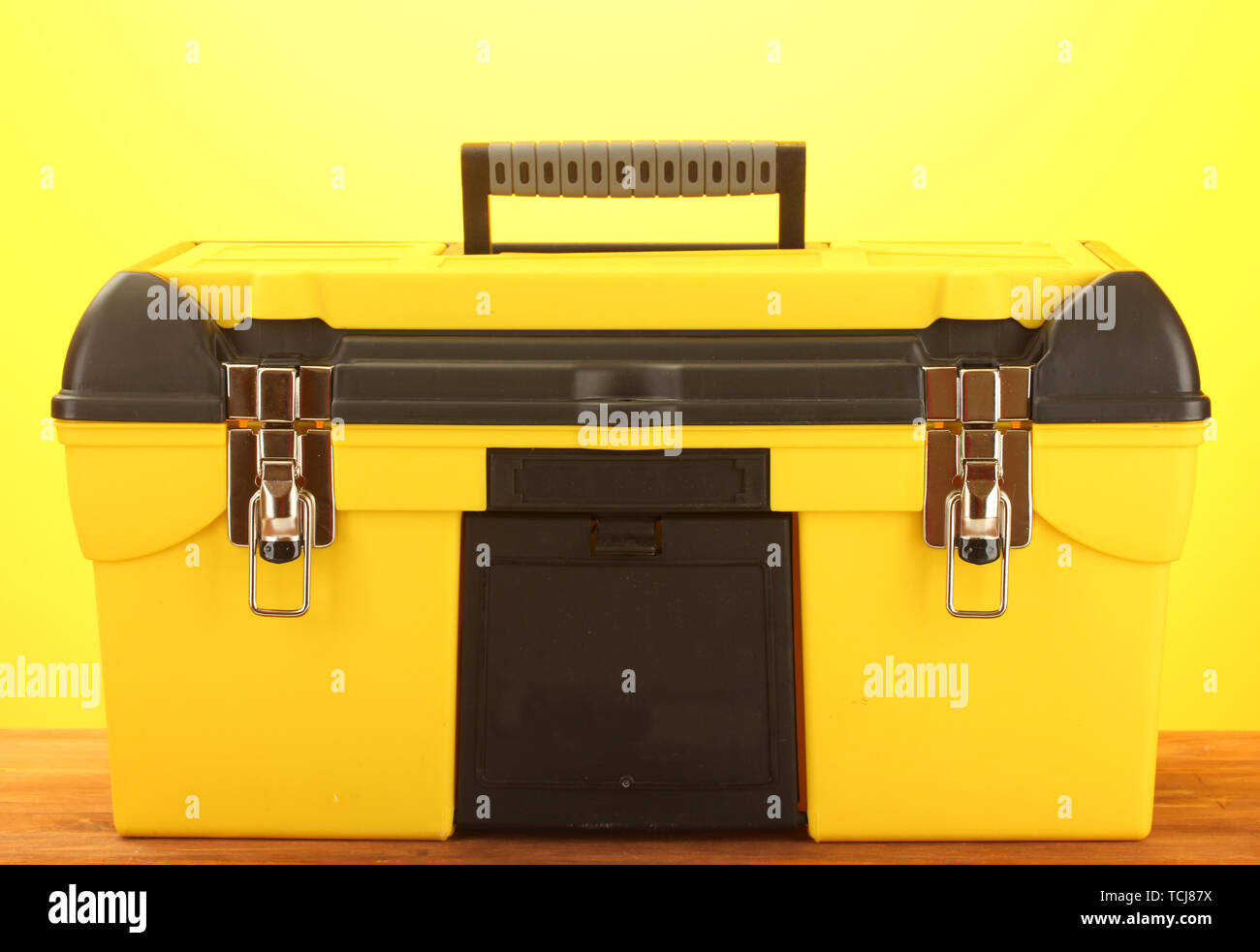 yellow tool box on yellow background close-up Stock Photo - Alamy
