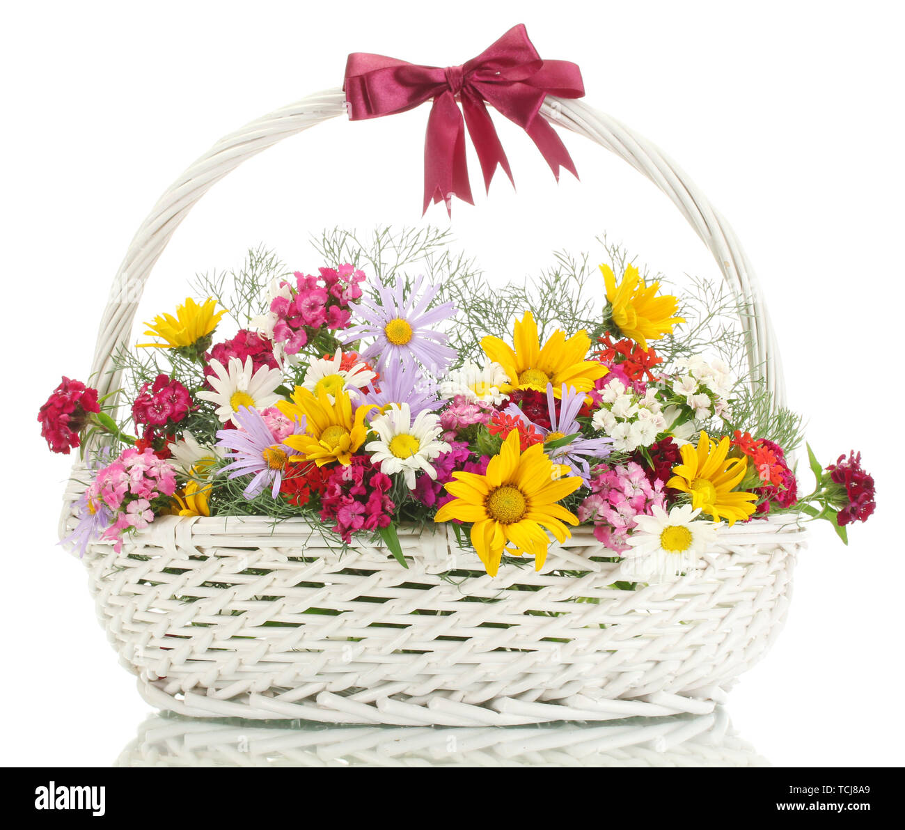beautiful bouquet of bright wildflowers in basket, isolated on white ...