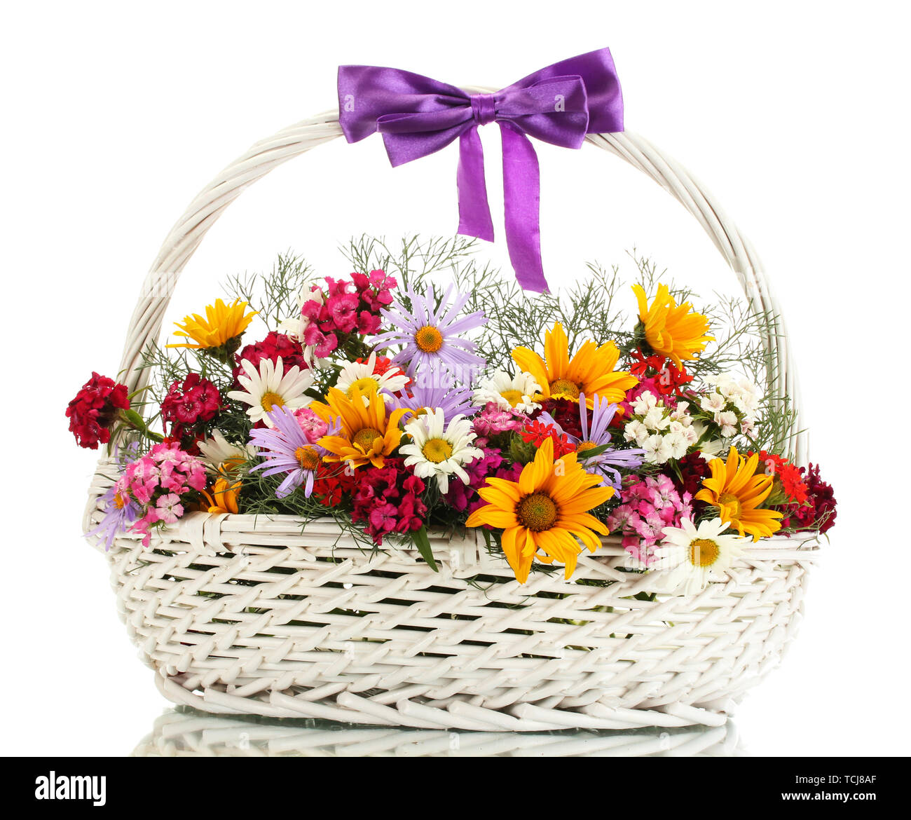 beautiful bouquet of bright wildflowers in basket, isolated on white ...