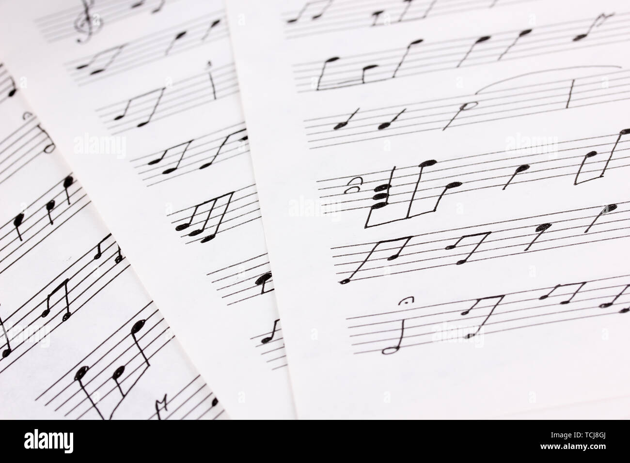 Musical notes and feather close-up Stock Photo - Alamy