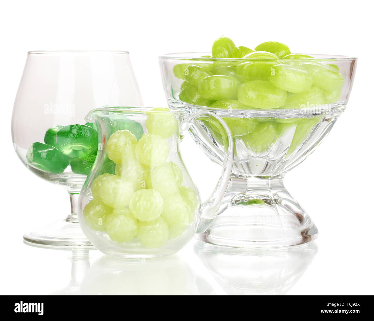 Color candies in glasses isolated on white Stock Photo - Alamy