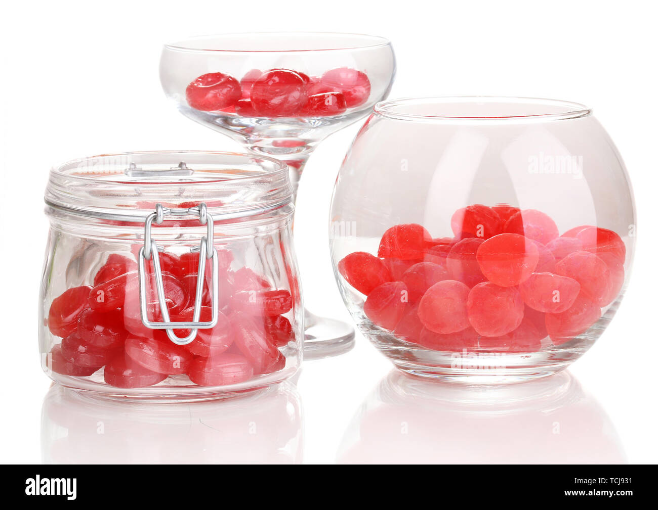 Color candies in glasses isolated on white Stock Photo - Alamy
