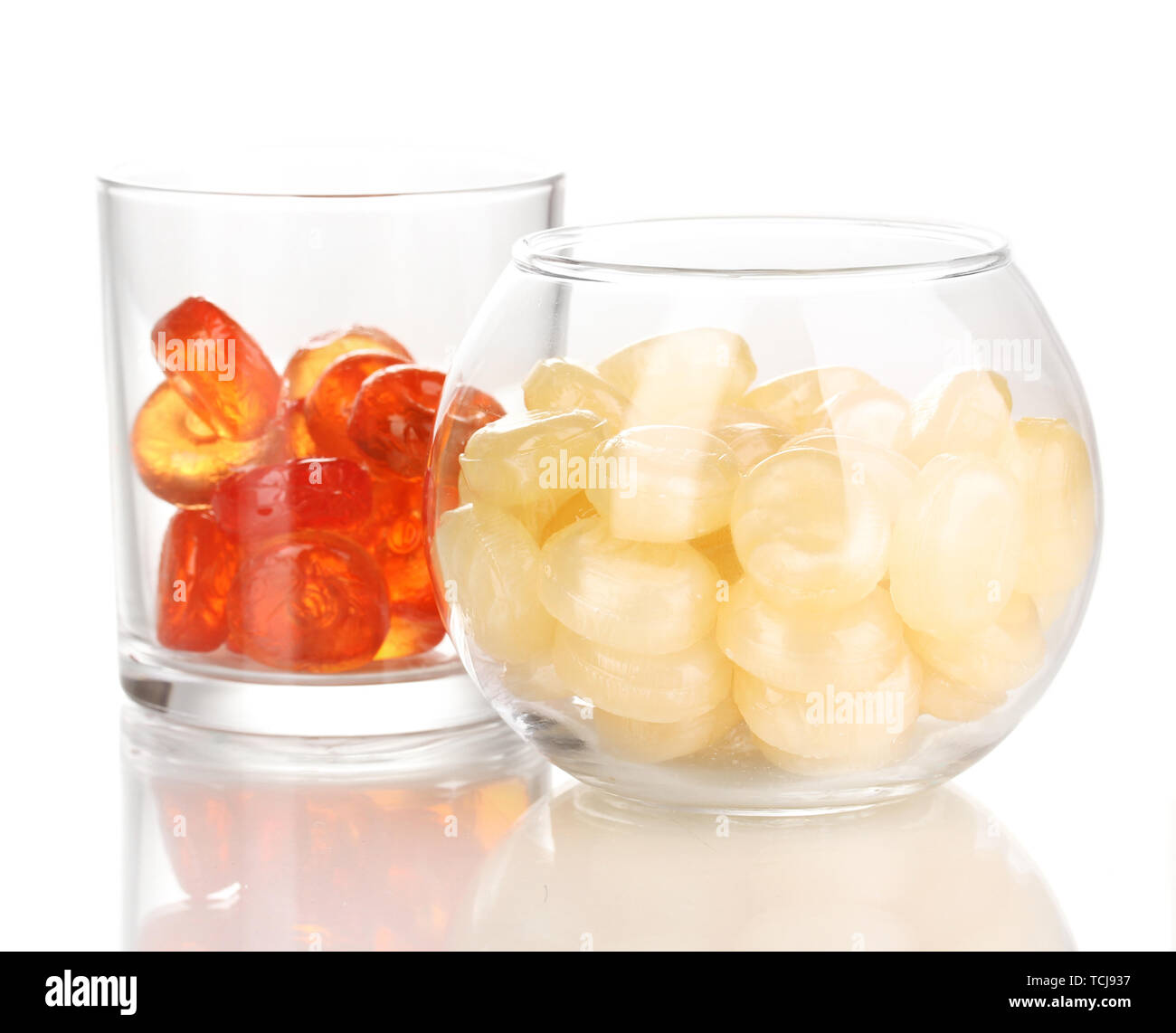 Color candies in glasses isolated on white Stock Photo - Alamy