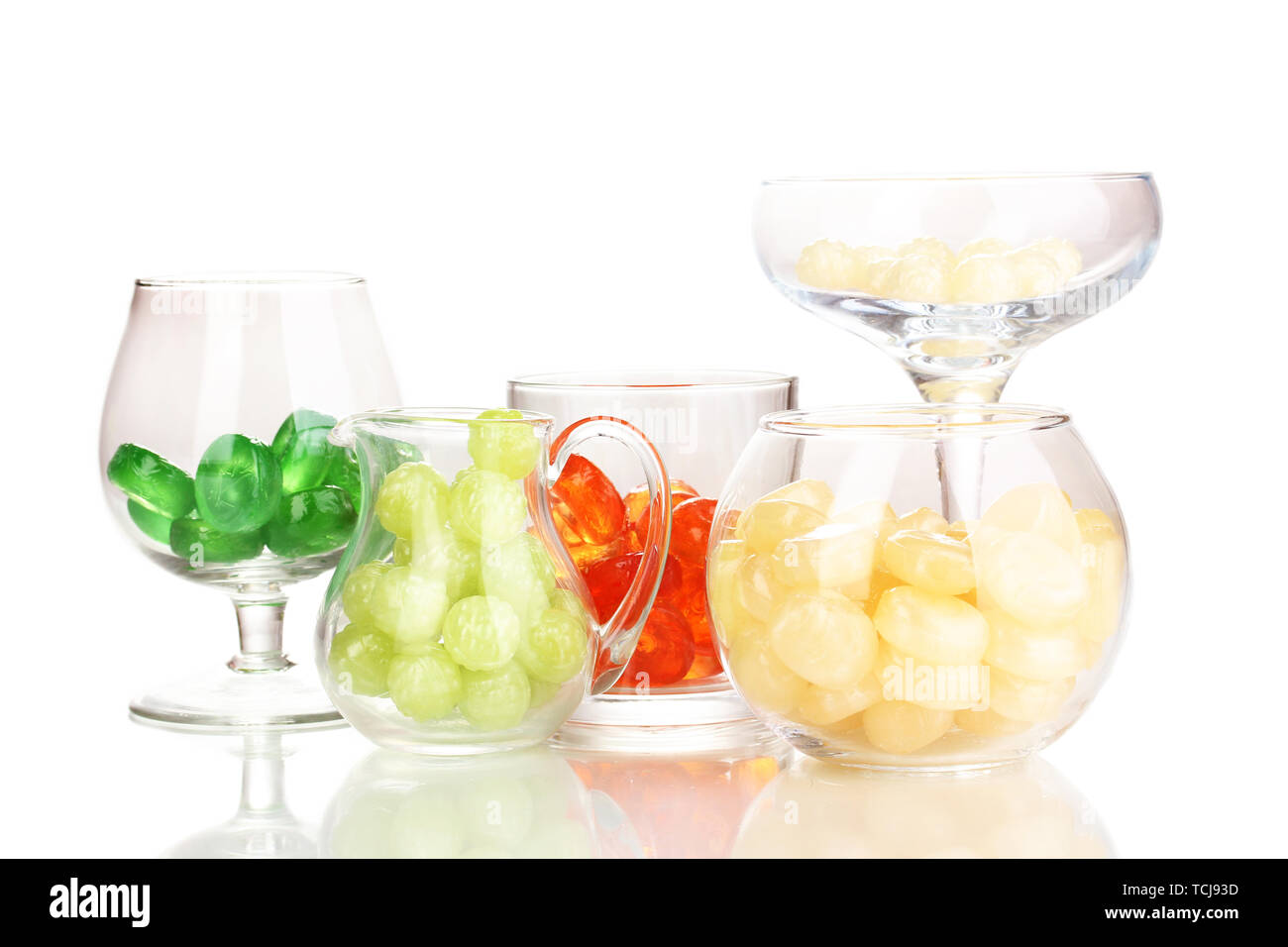 Color candies in glasses isolated on white Stock Photo - Alamy