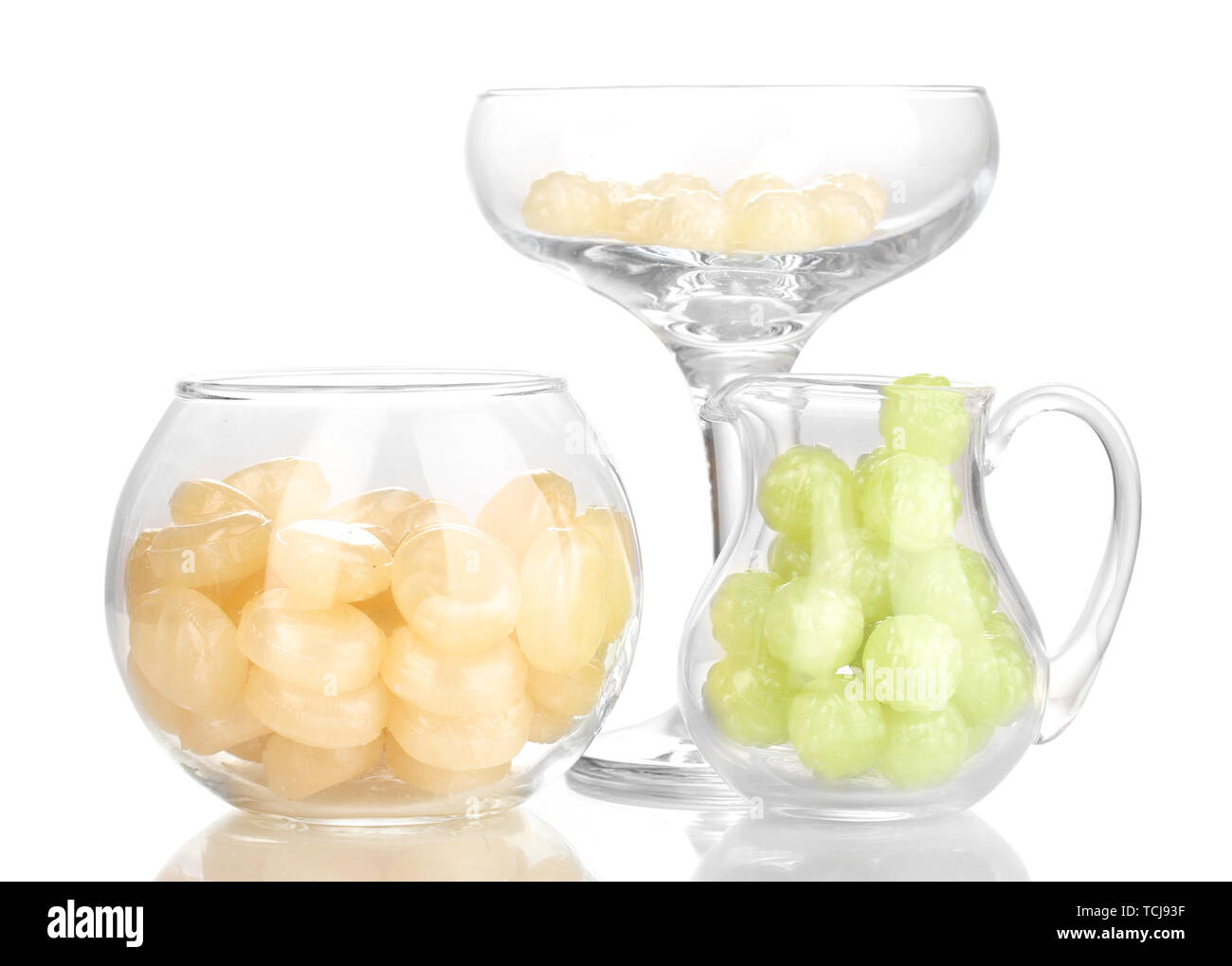 Color candies in glasses isolated on white Stock Photo - Alamy
