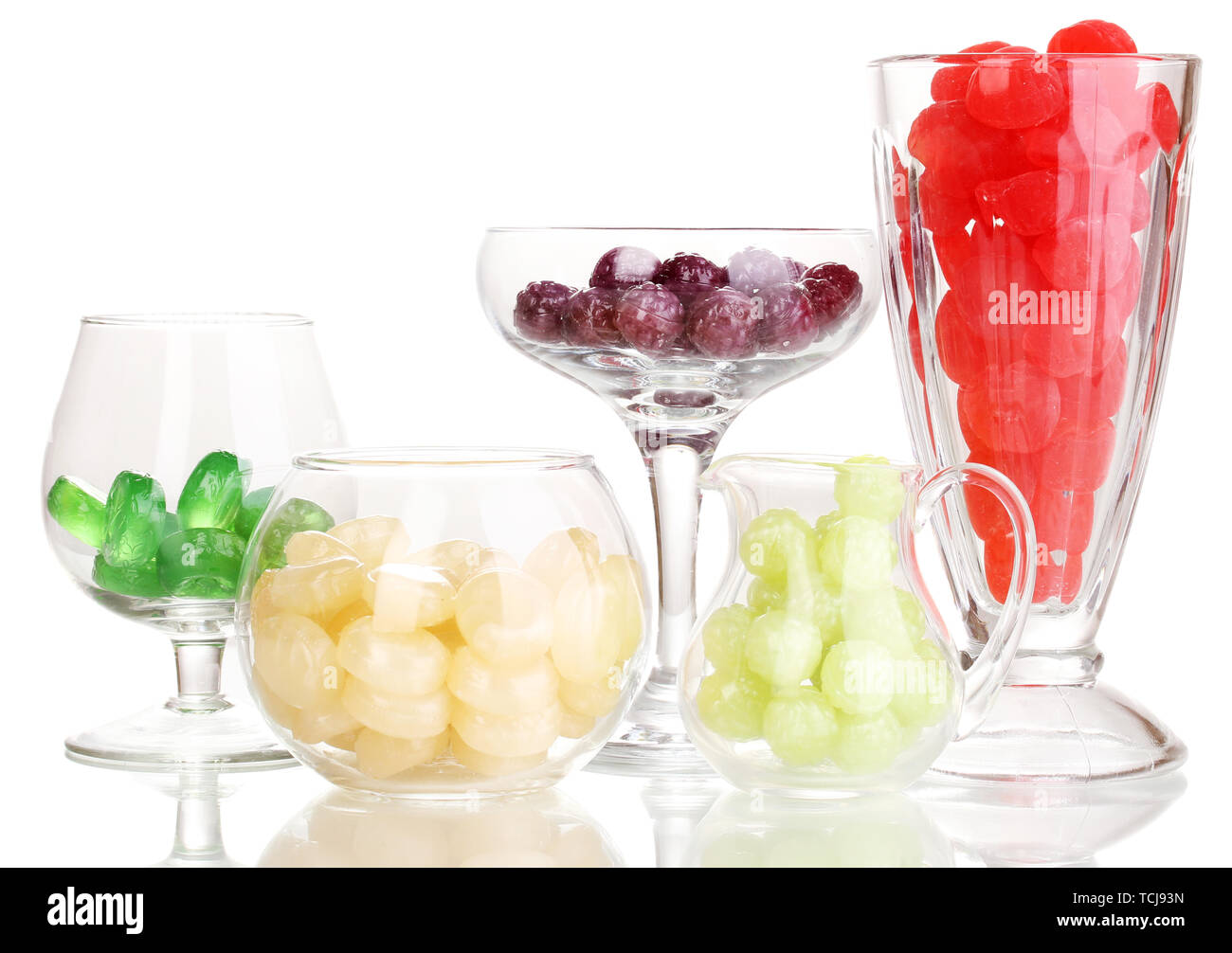 Color candies in glasses isolated on white Stock Photo - Alamy