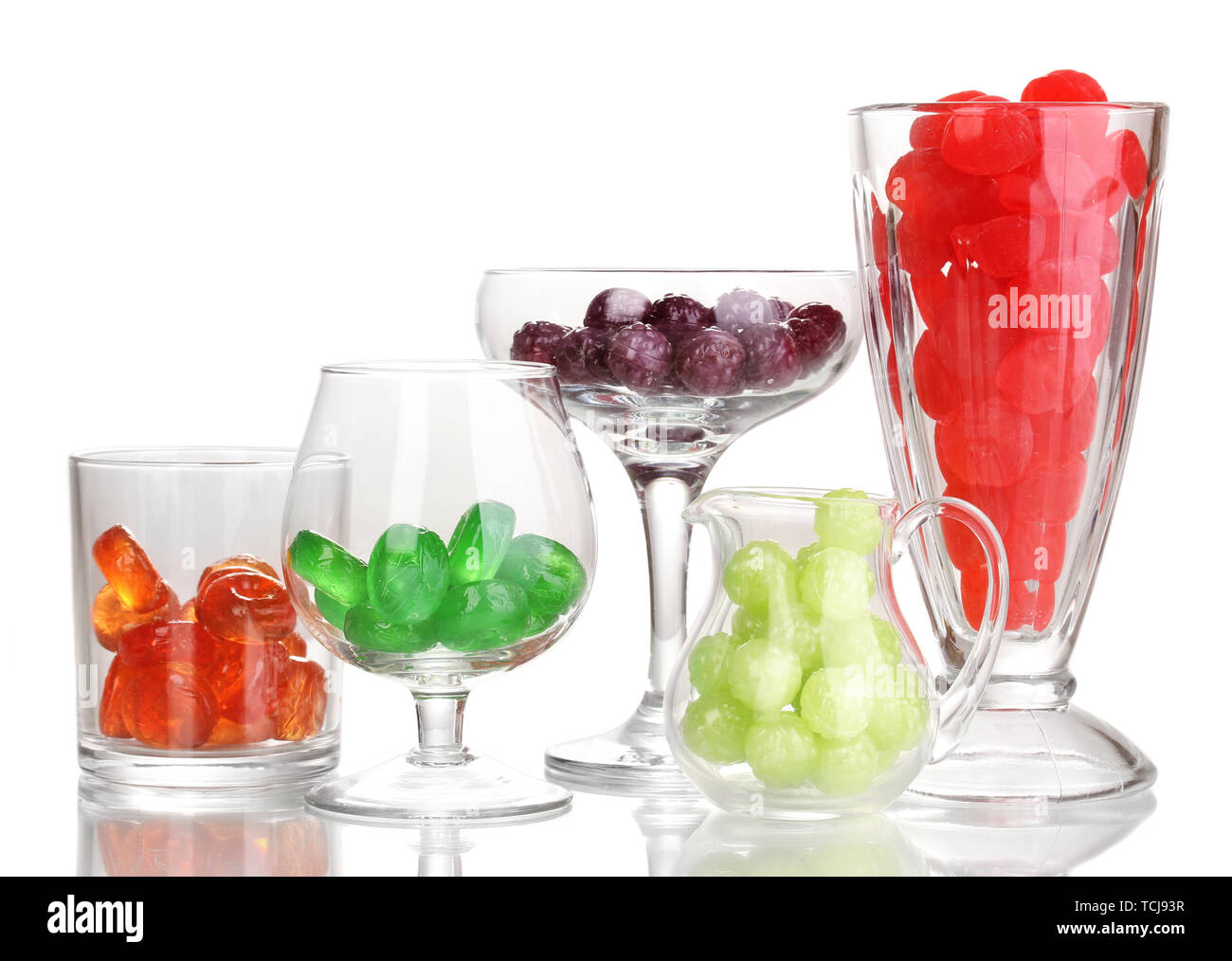 Color candies in glasses isolated on white Stock Photo - Alamy