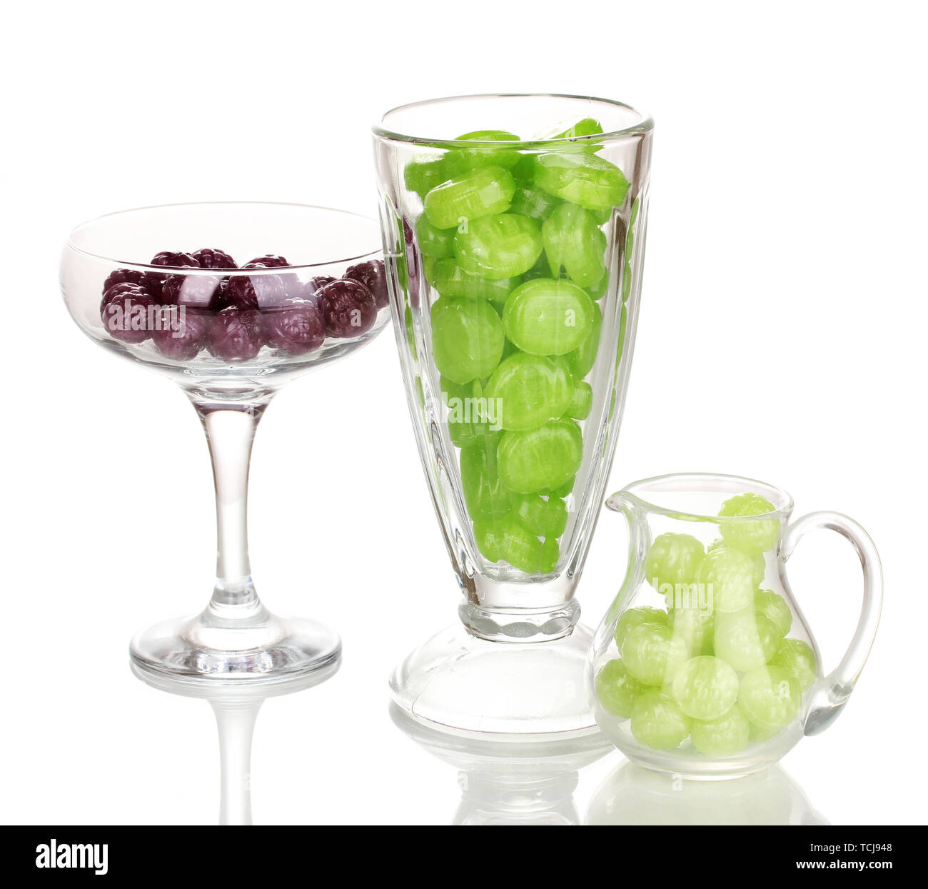 Color candies in glasses isolated on white Stock Photo - Alamy