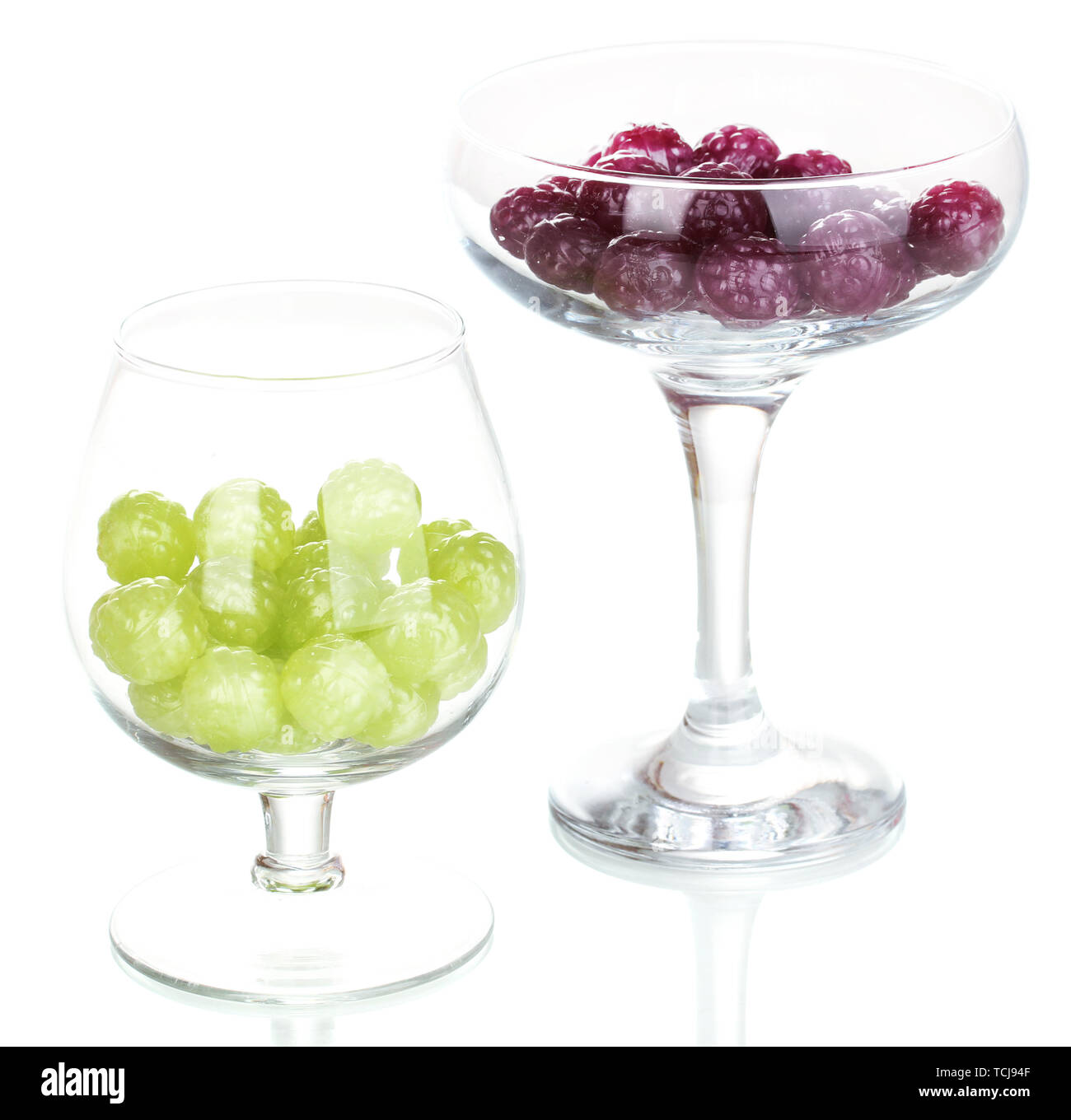 Color candies in glasses isolated on white Stock Photo - Alamy