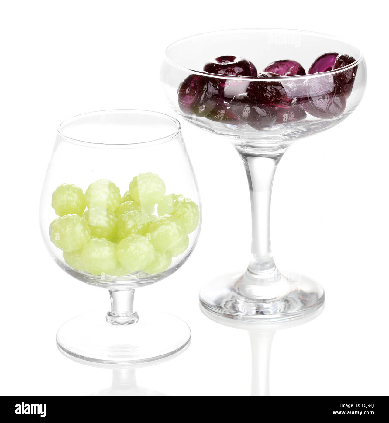 Color candies in glasses isolated on white Stock Photo - Alamy
