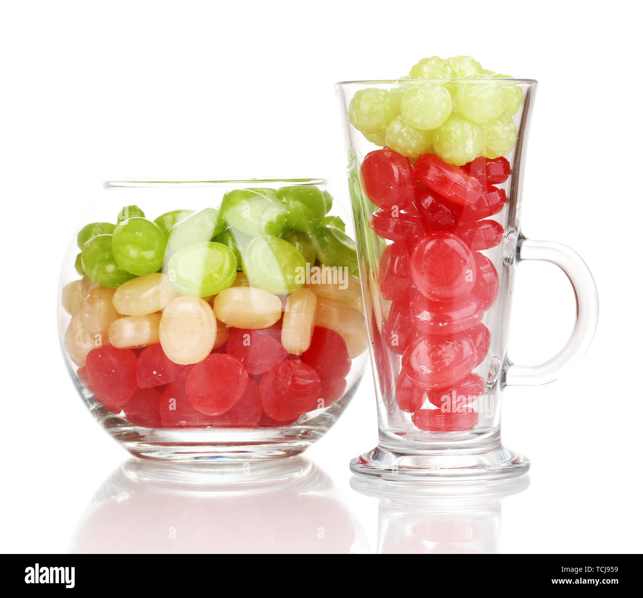 Color candies in glasses isolated on white Stock Photo - Alamy