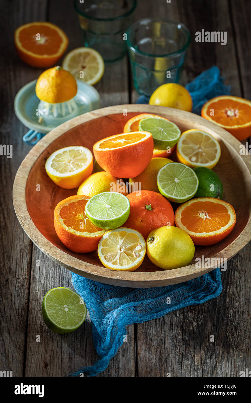 Healthy and fresh mix of citrus fruits on rustic table Stock Photo - Alamy