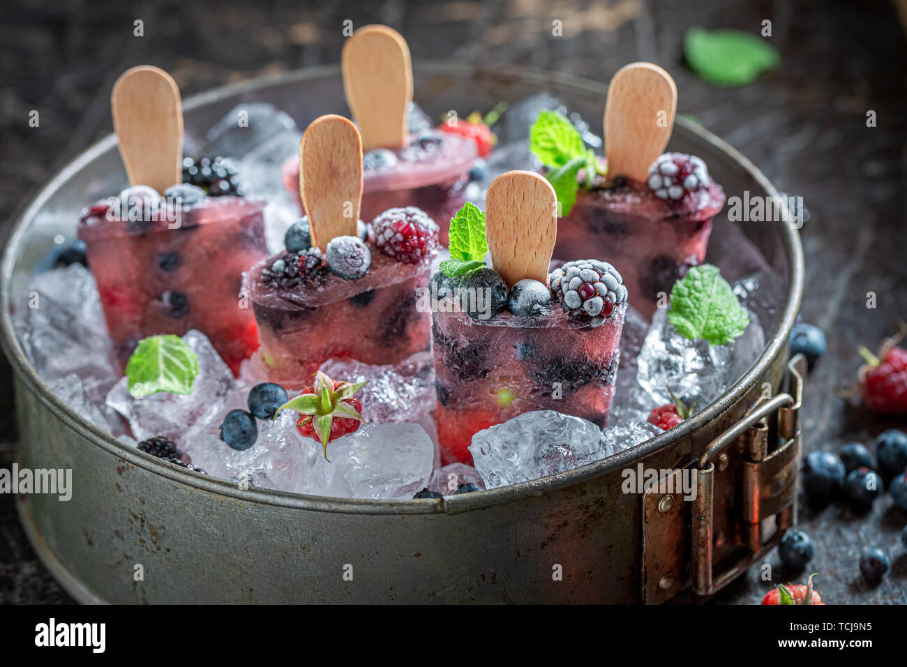 Homemade and cold berry fruits ice cream on a stick Stock Photo - Alamy