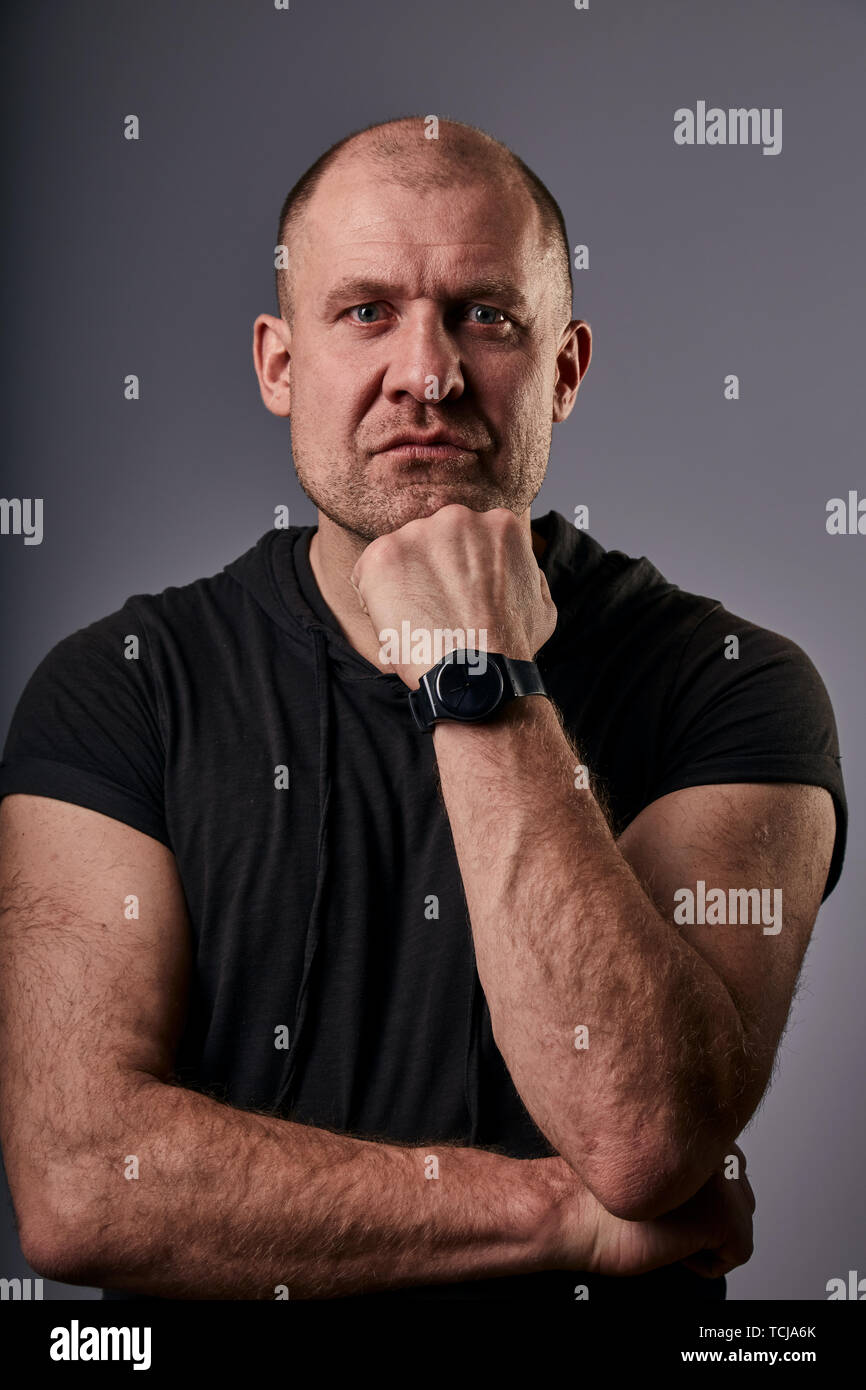 Unhappy depressed man with very sad eyes looking with hand under the ...