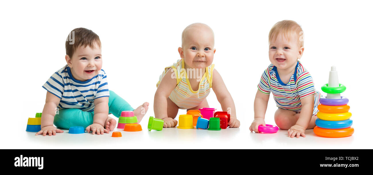 Nursery babies toddlers playing with toys isolated on white background ...