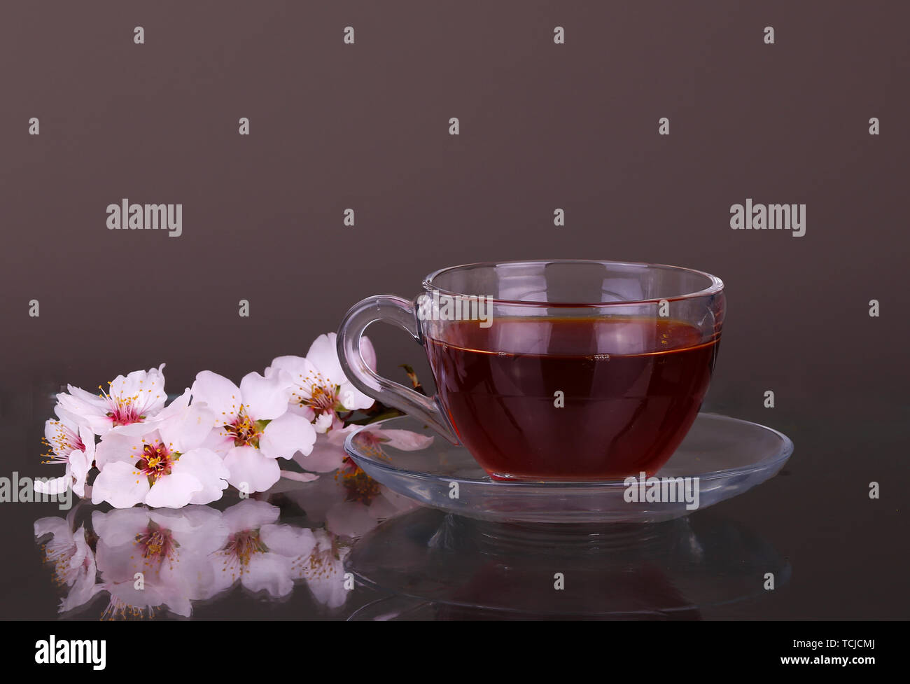 cup of tea and cherry branch Stock Photo - Alamy