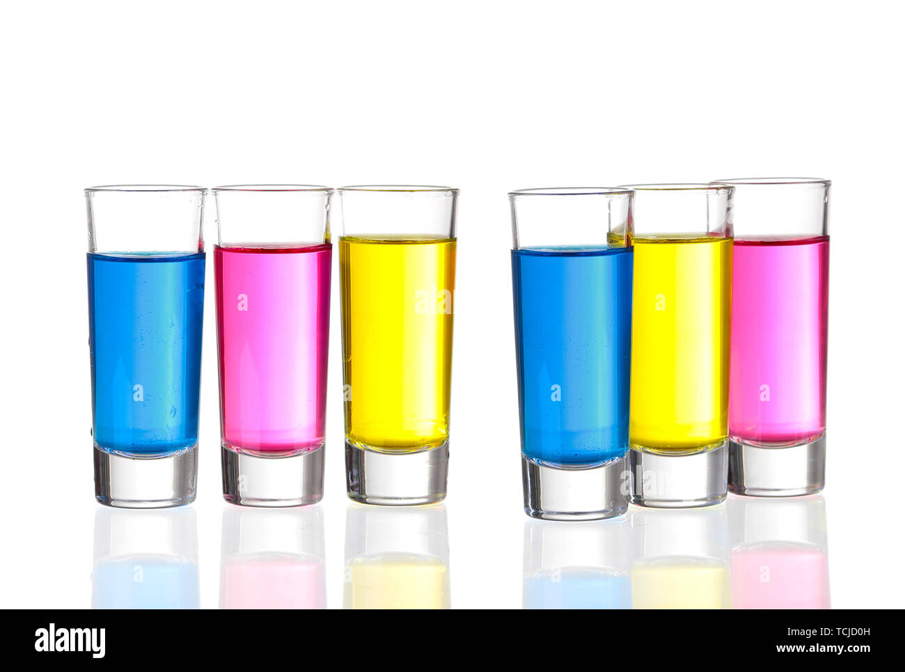 Shots - Three colourful shot drinks on a white background with ...