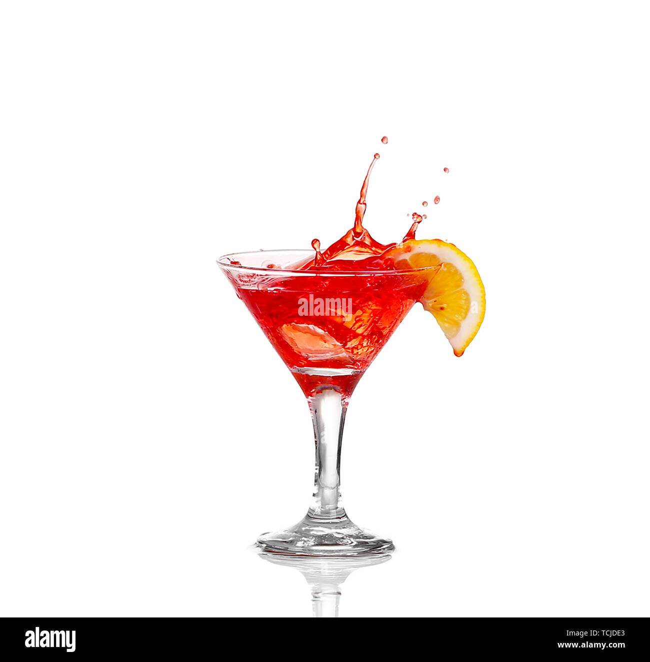 Cocktail with splash and lime slice isolated on white Stock Photo - Alamy