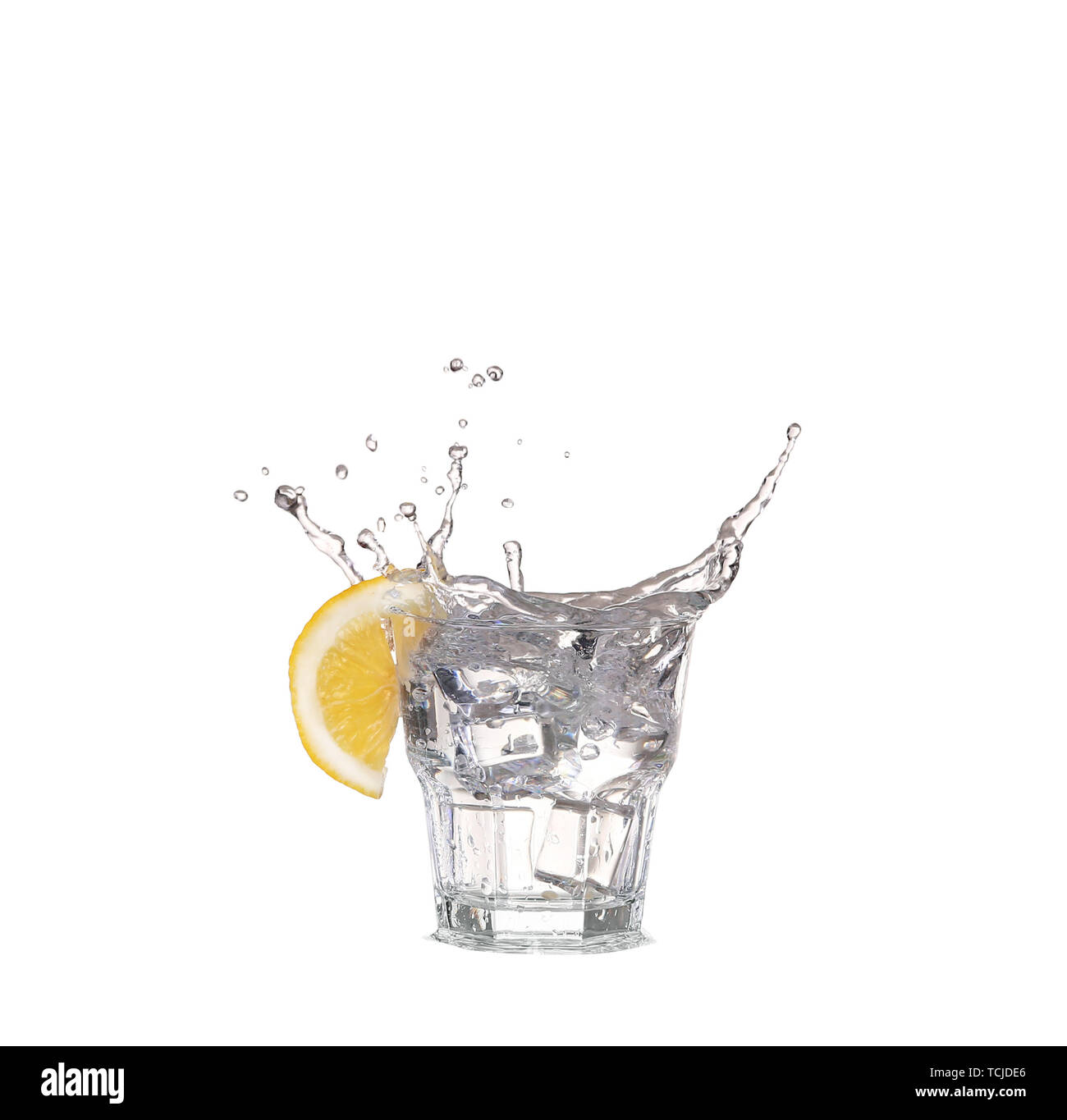 Ice cubes splashing into glass of water, isolated on white Stock Photo ...