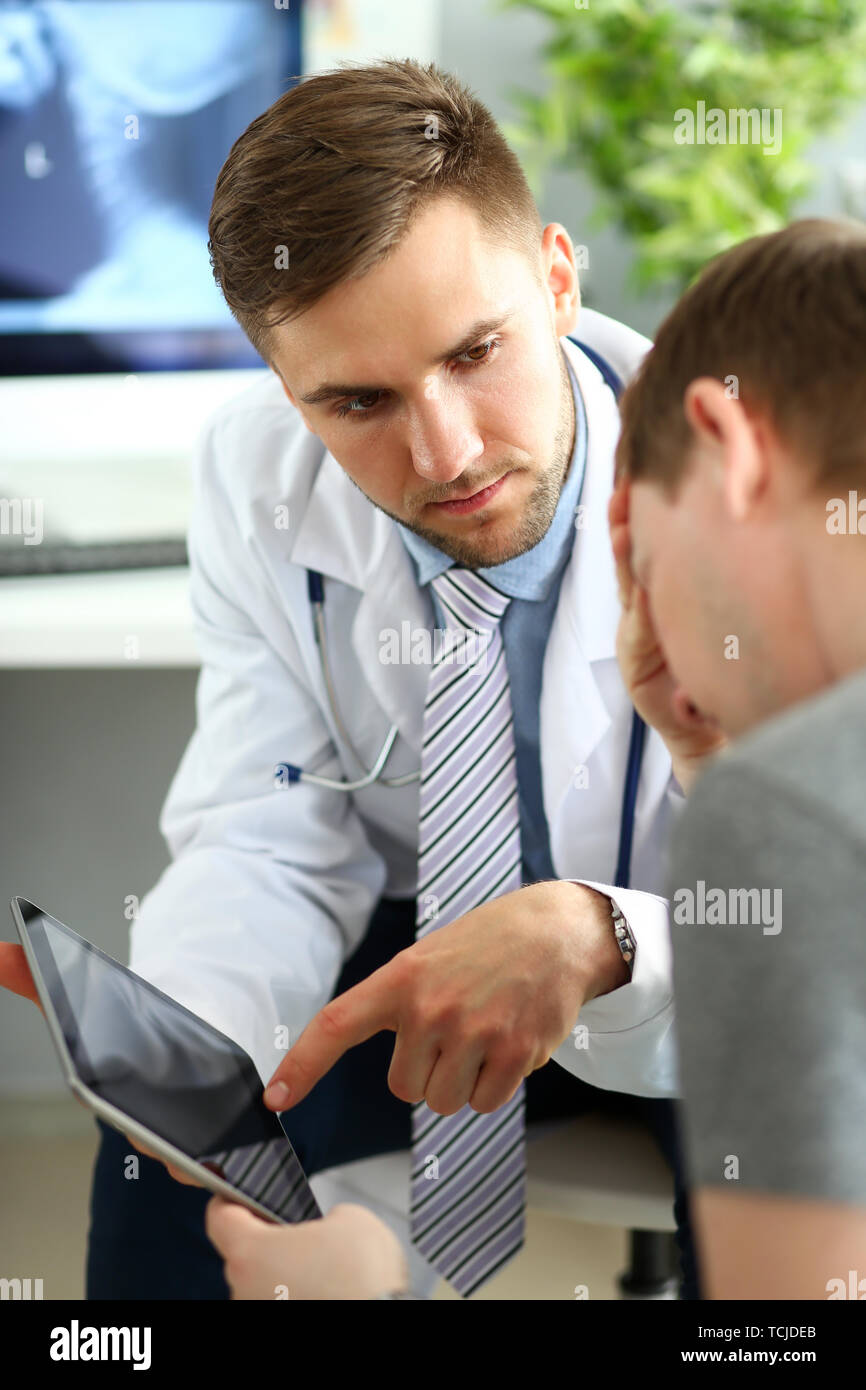 Sad patient at doctors cabinet Stock Photo - Alamy
