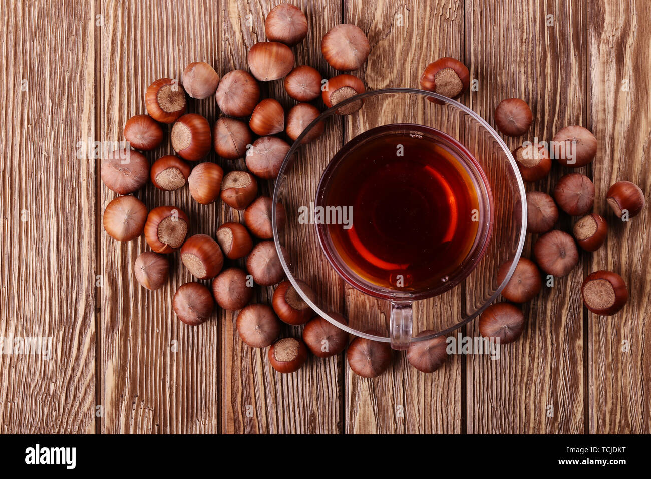 Autumn harvest. nuts on a dark recycled wood background, with copy ...