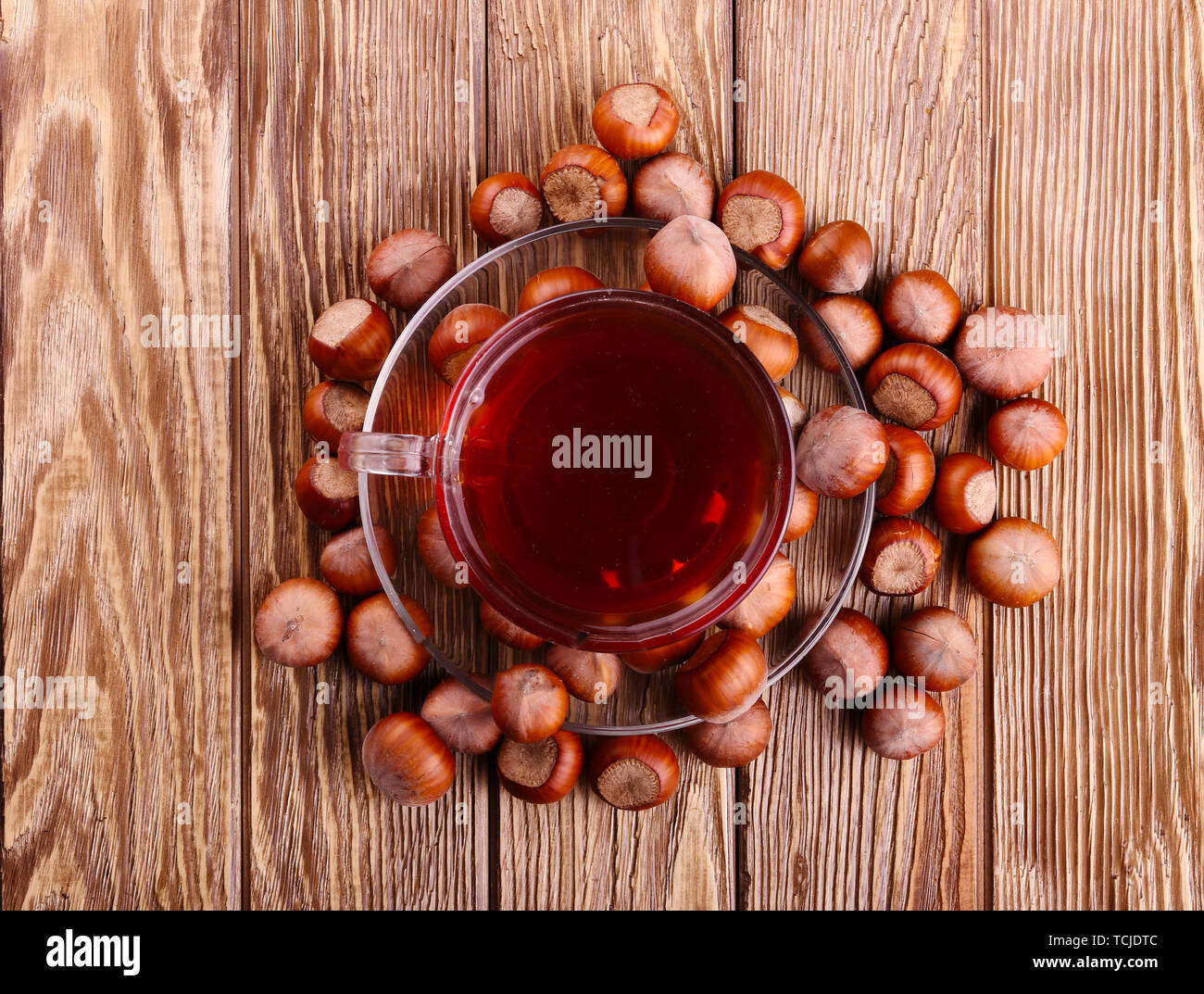 Autumn harvest. nuts on a dark recycled wood background, with copy ...