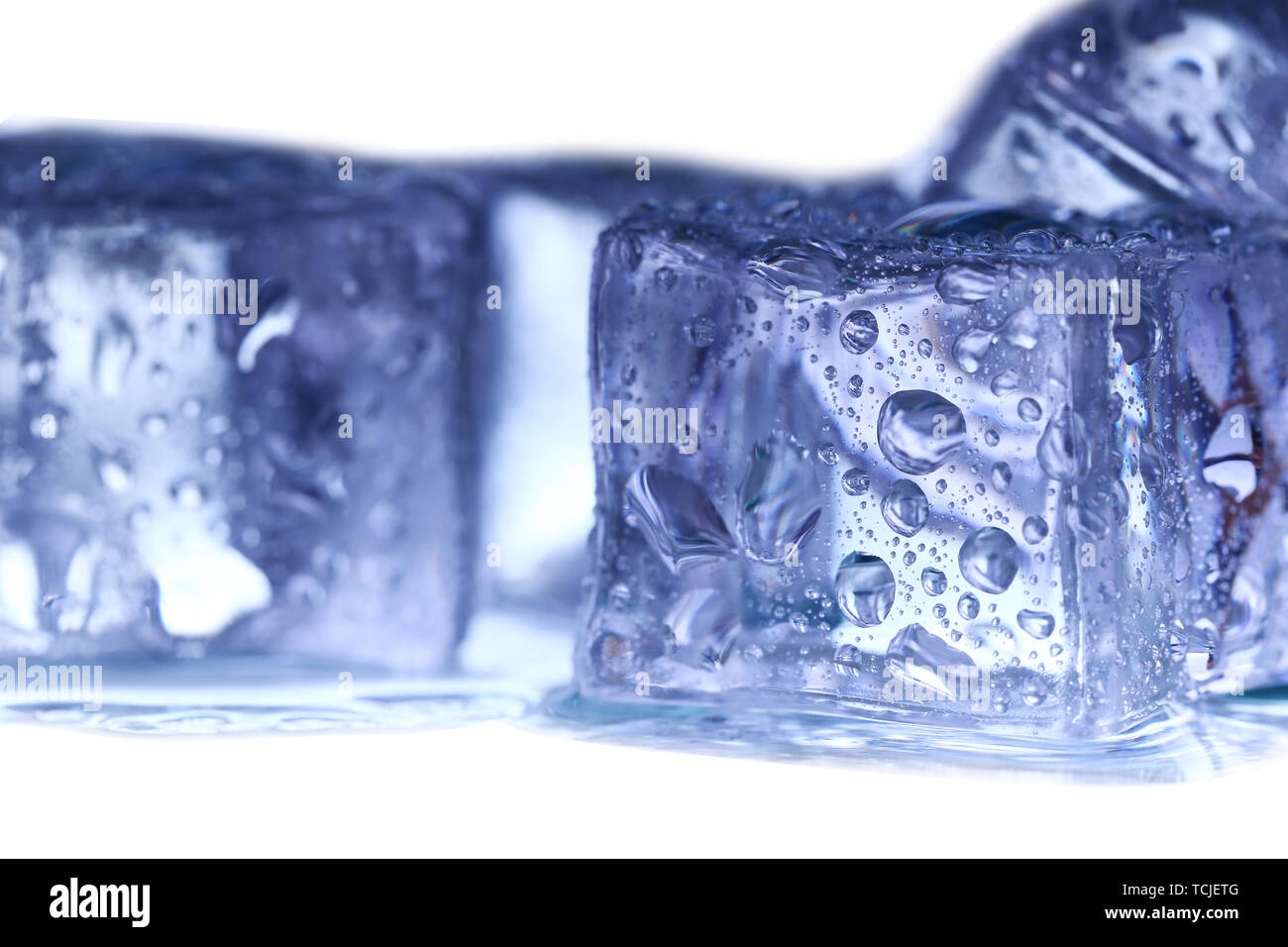 Ice cubes on white background Stock Photo - Alamy