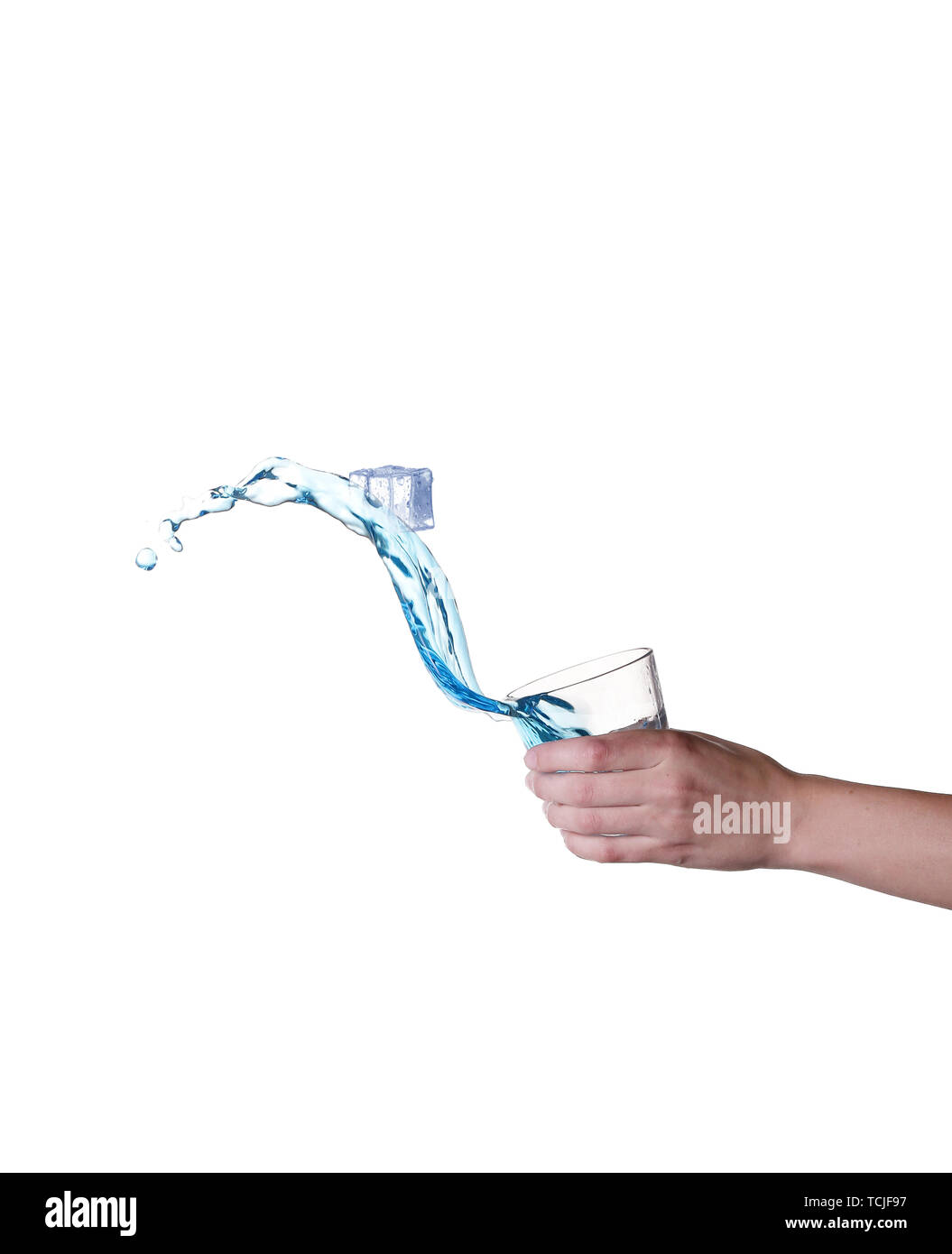 Blue water splashing in glass held by hand, white background Stock ...