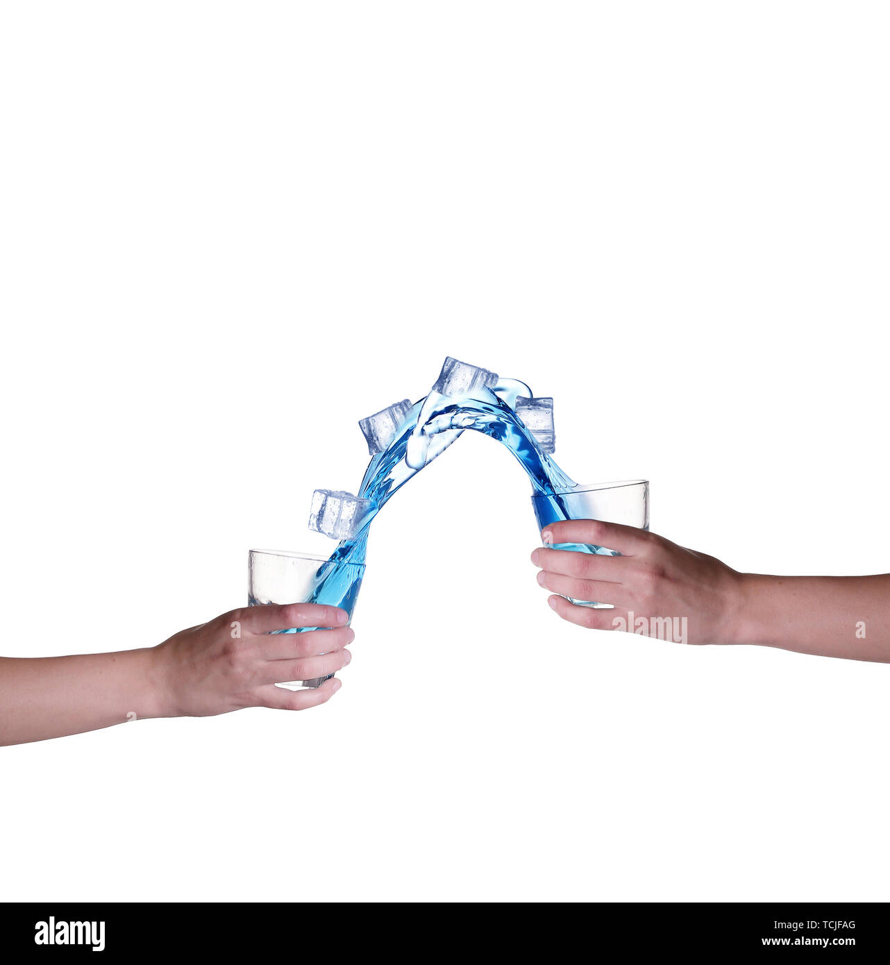 Blue water splashing in glass held by hand, white background Stock ...