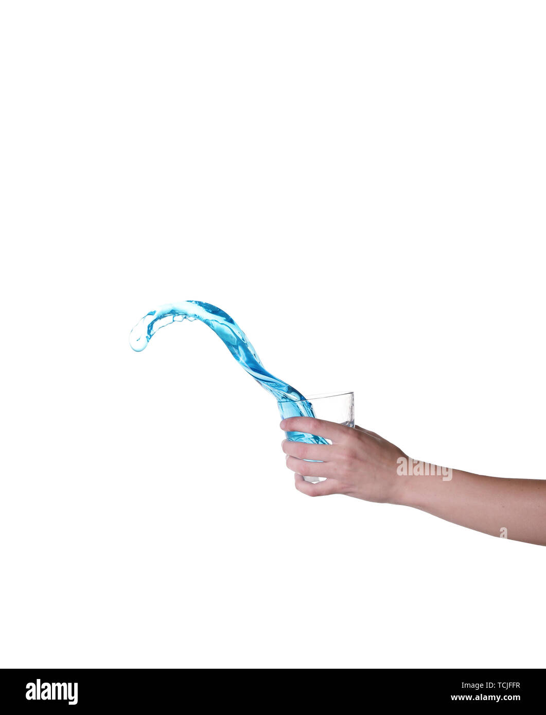 Blue water splashing in glass held by hand, white background Stock ...