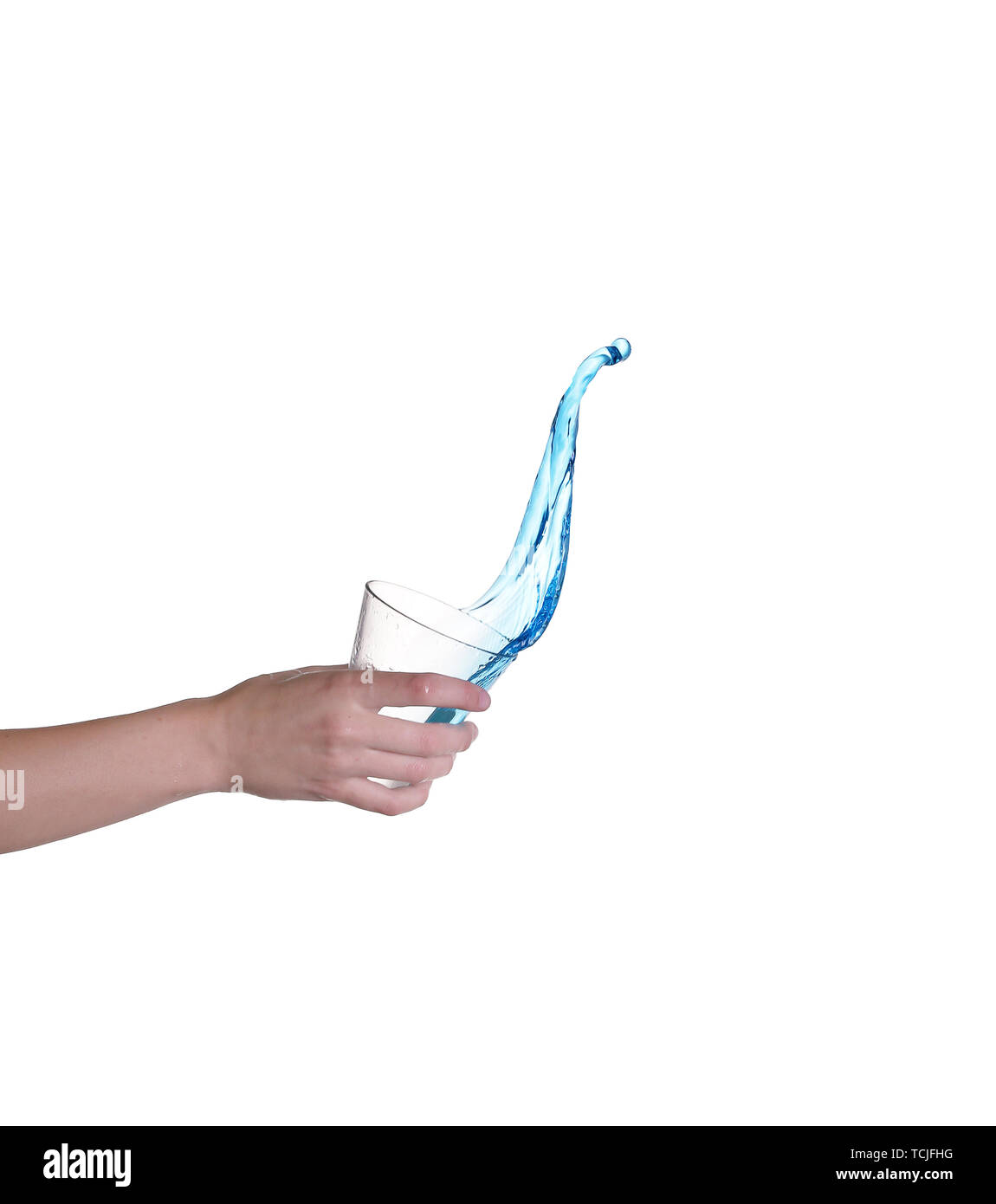 Blue water splashing in glass held by hand, white background Stock ...